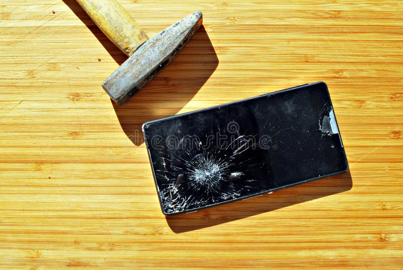 Smashed Phone Screen on a Table with a Hammer Stock Image - Image of ...