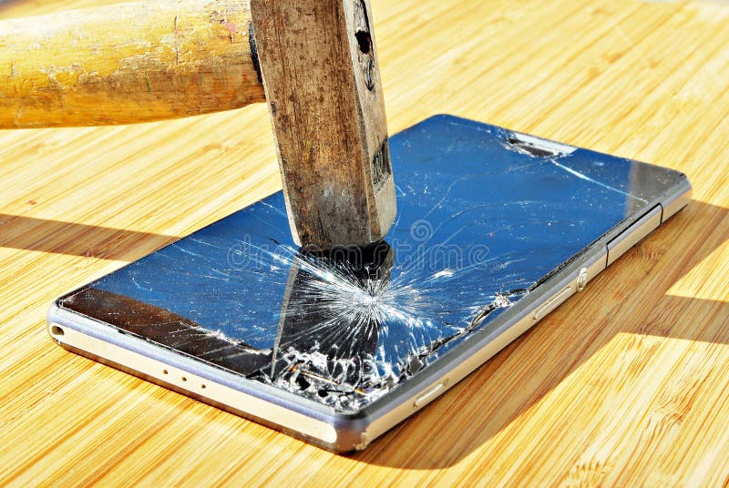 Smashed Phone Screen on a Table with a Hammer Stock Photo - Image of ...