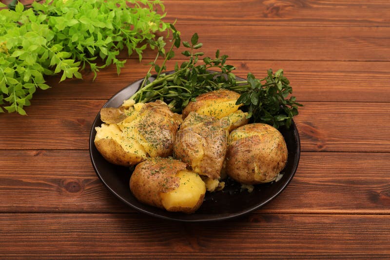 Smashed Potatoes and Watercress on a Plate Stock Image - Image of ...