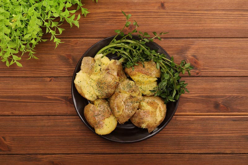 Smashed Potatoes and Watercress on a Plate Stock Image - Image of oven ...