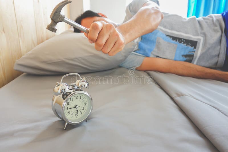 Smashing an Alarm Clock stock photo. Image of doze, slumber - 1099004