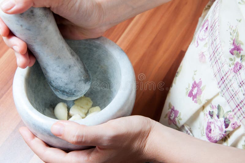 Smashing garlic stock photo. Image of food, isolated - 56940348