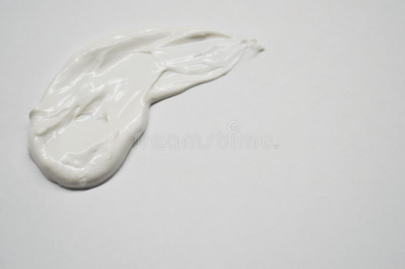Smeared Drop of White Cream on White Background Stock Photo - Image of ...