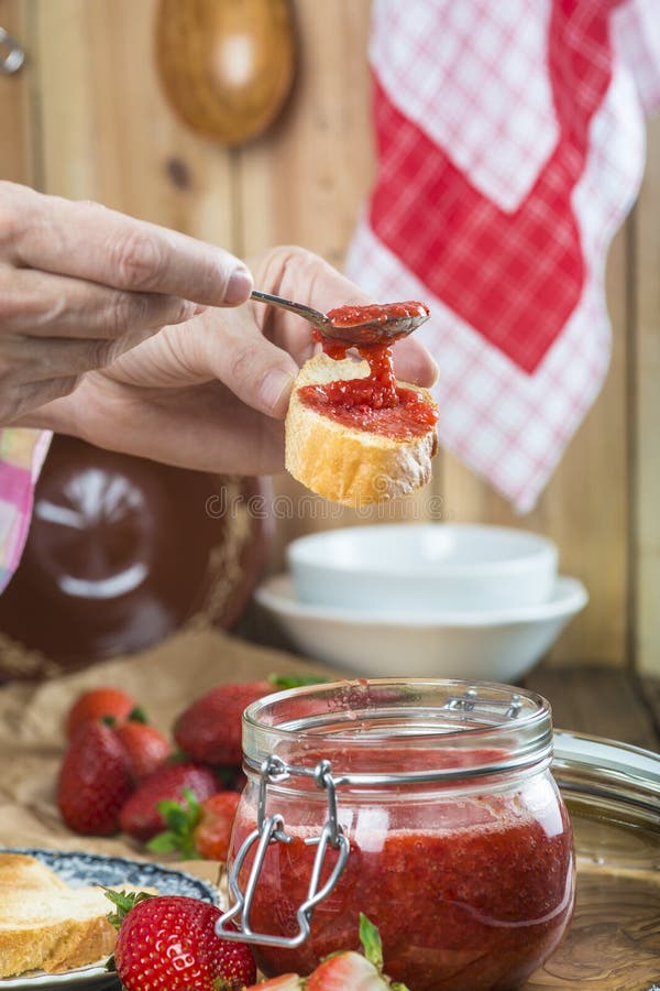 Smearing Strawberry Jam on a Toast for Breakfast Stock Image - Image of ...