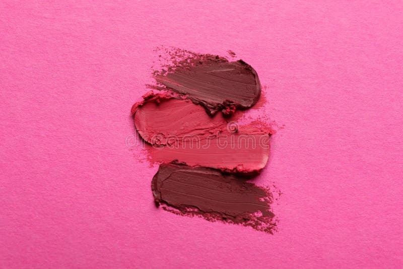 Smears of Beautiful Lipsticks on Pink Background, Top View Stock Photo ...