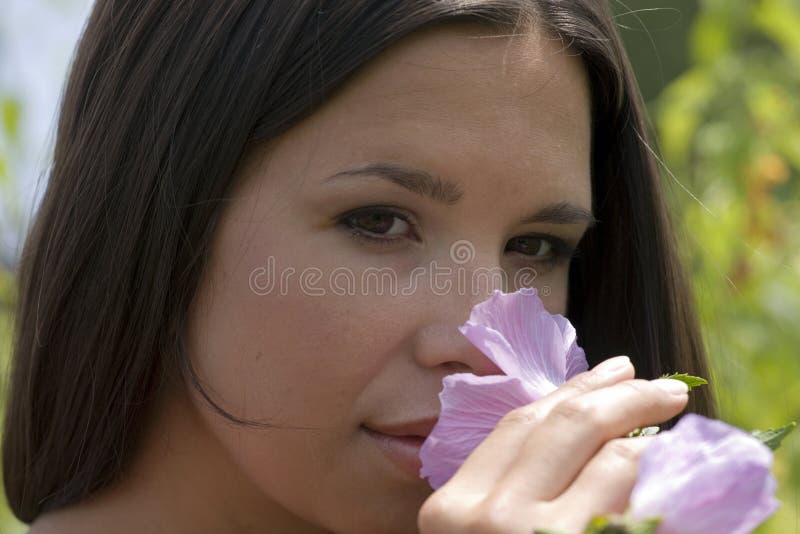 Smelling the flowers stock photo. Image of nature, posing - 11015170
