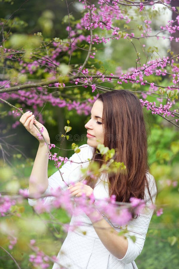 Smelling the Flowers on the Tree Stock Photo - Image of hair, face ...