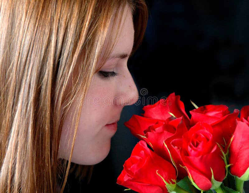 Smelling red roses stock image. Image of profile, roses - 1412041