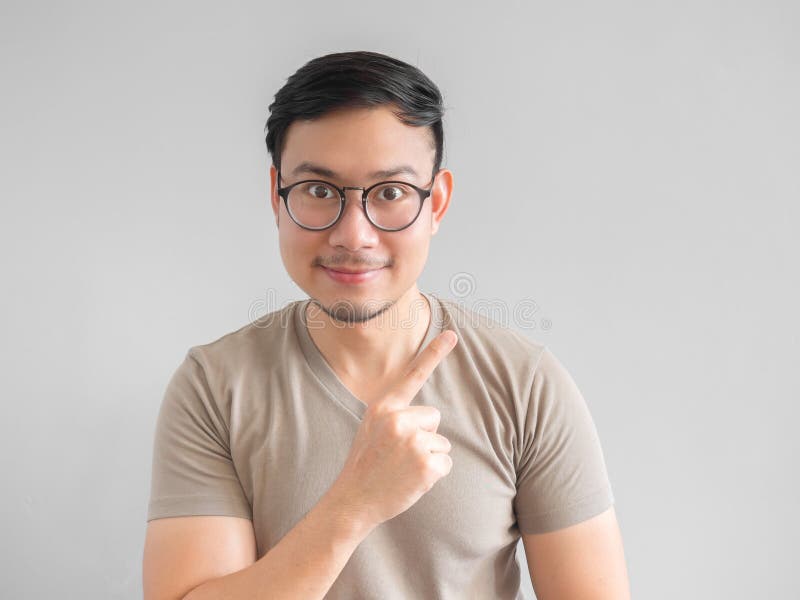 Smile Asian man pointing. stock image. Image of confident - 83779069