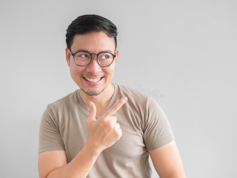 Smile Asian man pointing. stock photo. Image of model - 84177776
