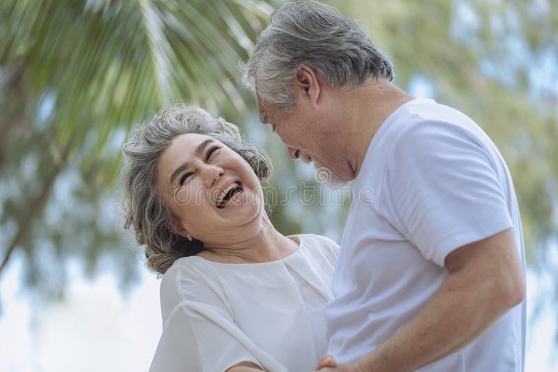 Asian Senior Happy Retired Couple Relax Smiling Elder Man And Woman
