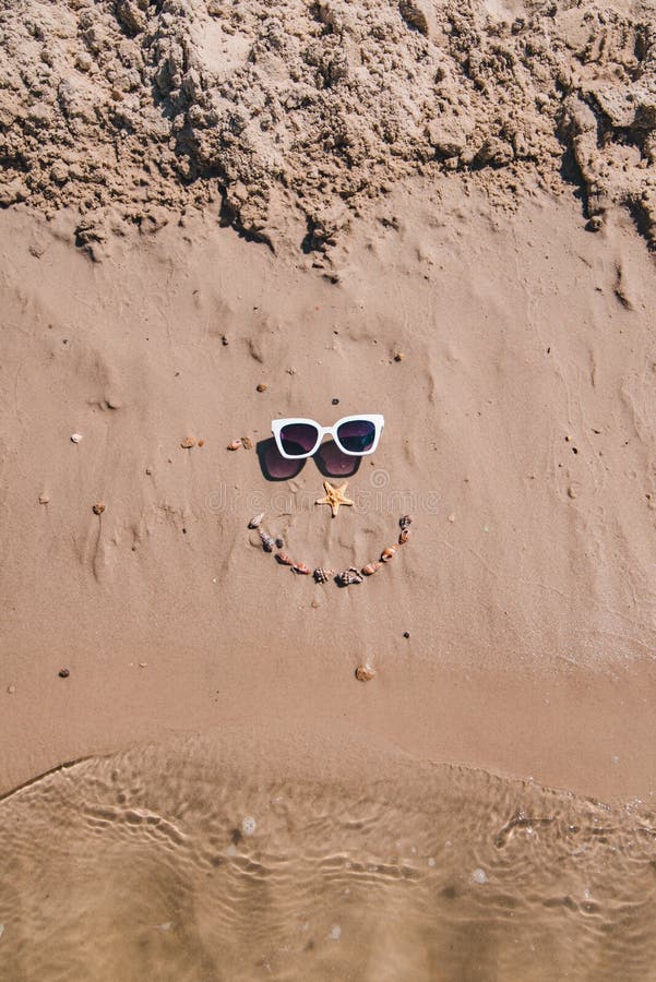 Smile Face Drawn on Sand with Shells and Sunglasses Stock Photo - Image ...