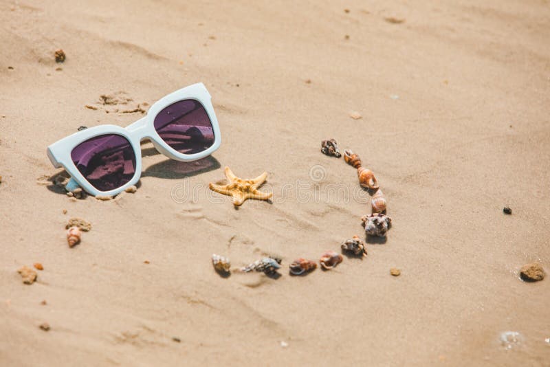 Smile Face Drawn on Sand with Shells and Sunglasses Stock Photo - Image ...