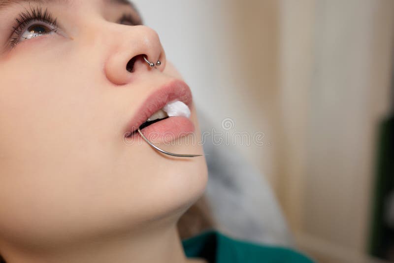 Smile or Frenulum Piercing Under the Upper Lip. Stock Image - Image of ...