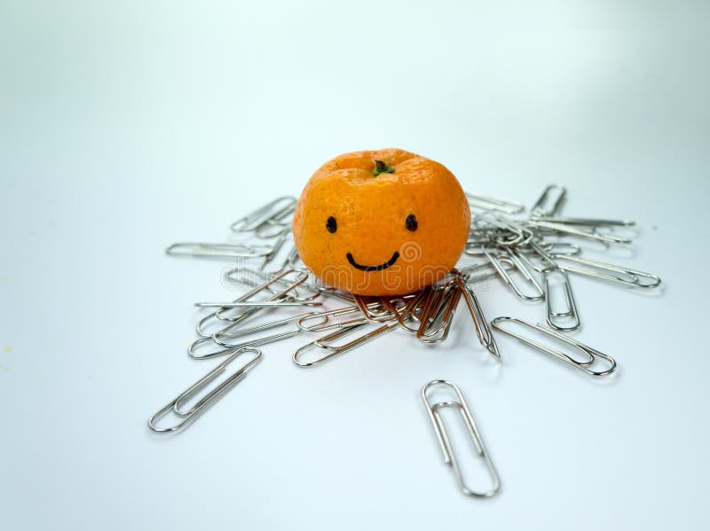 Smile orange on paperclip stock photo. Image of stationary - 63711996