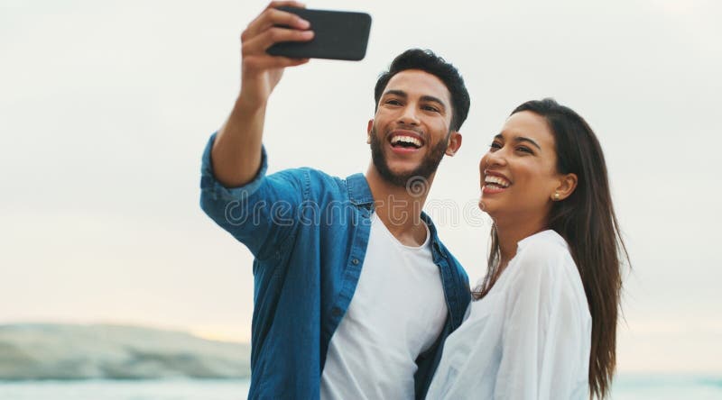 Smile for the Selfie Babe. a Happy Young Couple Posing for a Selfie ...