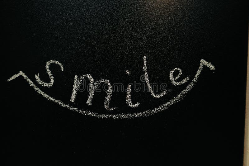 Smile. Text Handwritten in Chalk on a Chalkboard Stock Photo - Image of ...