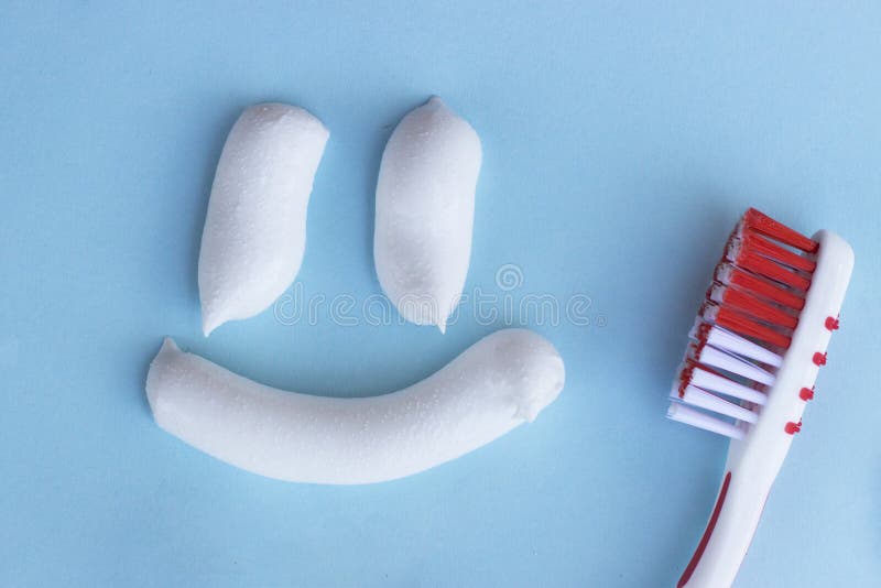 Smile from Toothpaste and Toothbrush on a Blue Background Stock Photo ...