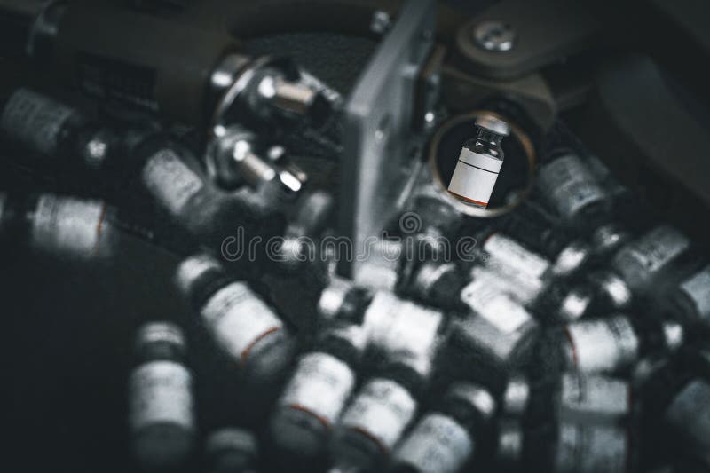 A Smile Vile is Reflected in the Glass of a Vintage Microscope in a ...