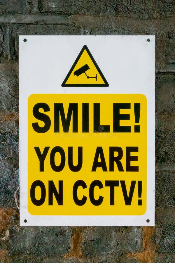 Smile you are on CCTV sign stock photo. Image of wall - 236830746