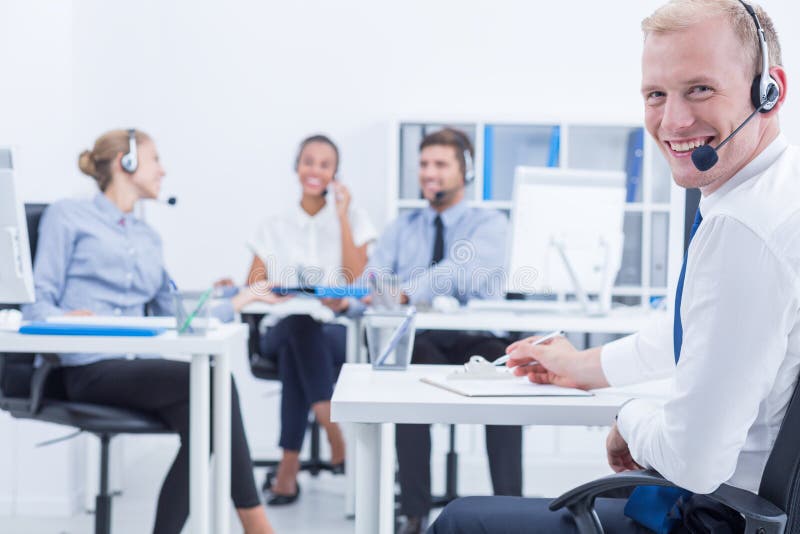 Smiled male telemarketer stock photo. Image of supplies - 82939444