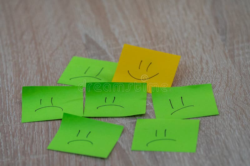 Smiley and Angry Faces are Drawn on the Sticker Sheets Green, Yellow ...