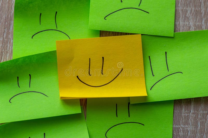 Smiley and Angry Faces are Drawn on the Sticker Sheets Green, Yellow ...