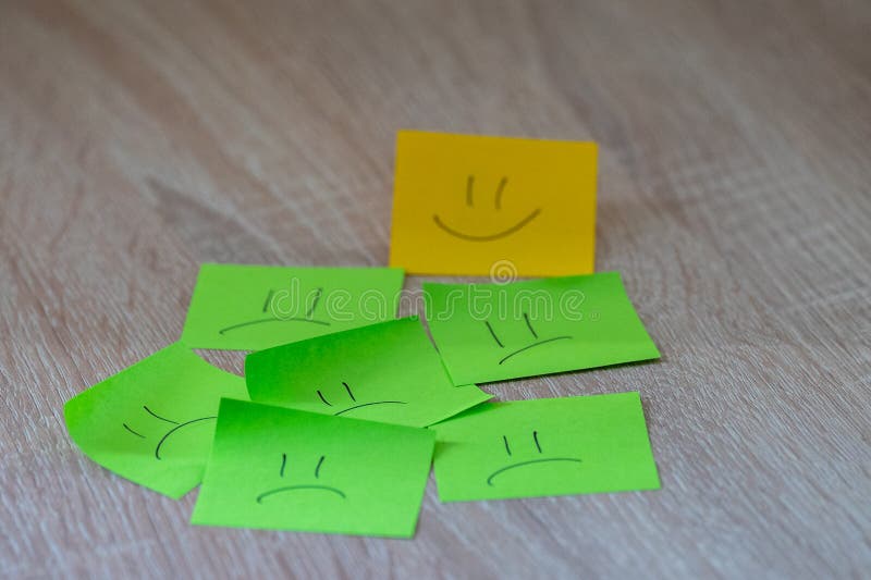 Smiley and Angry Faces are Drawn on the Sticker Sheets Green, Yellow ...