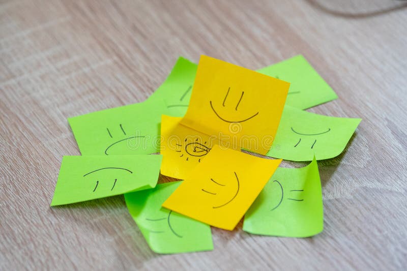 Smiley and Angry Faces are Drawn on the Sticker Sheets Stock Photo ...