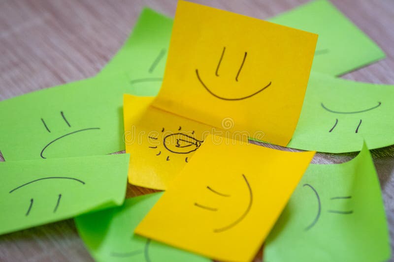 Smiley and Angry Faces are Drawn on the Sticker Sheets Stock Image ...
