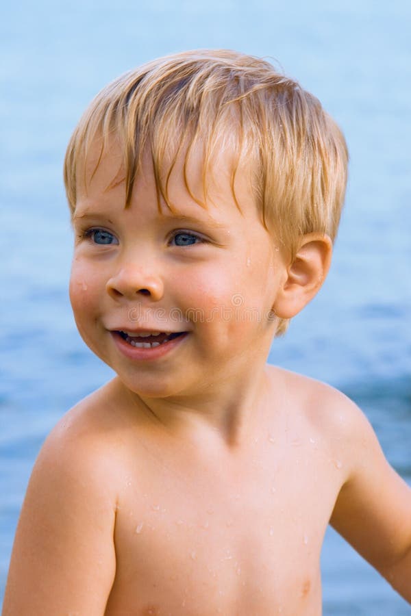 Cheerful Boy Swimming in the Sea Stock Photo - Image of smile, nature ...