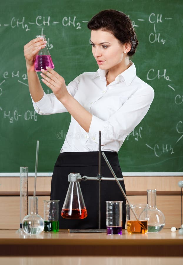 Smiley Chemistry Teacher Examines Conical Flask Stock Image - Image of ...