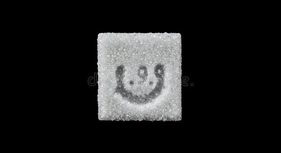 Smiley Face Design on Square Candy Cube Against Black Backdrop Stock ...