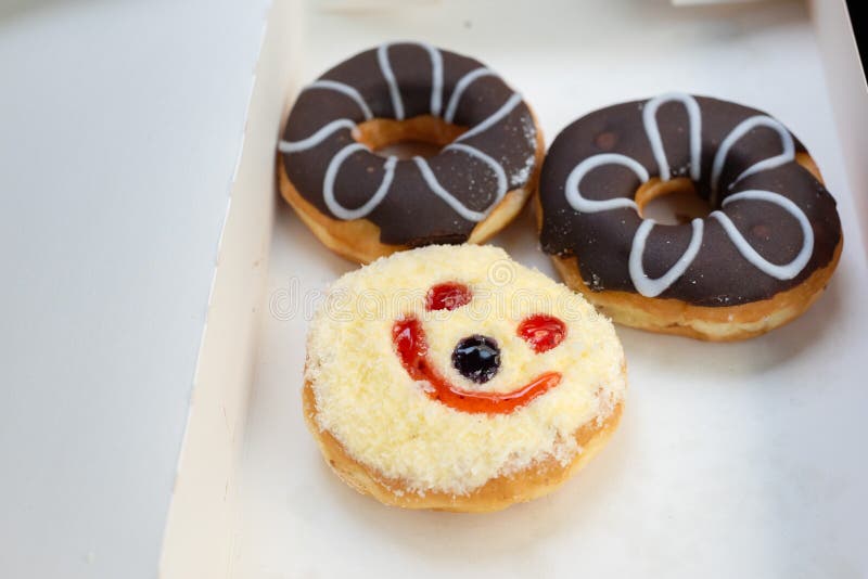 Smiley Face Donuts in a Cardboard Box Stock Photo - Image of donuts ...