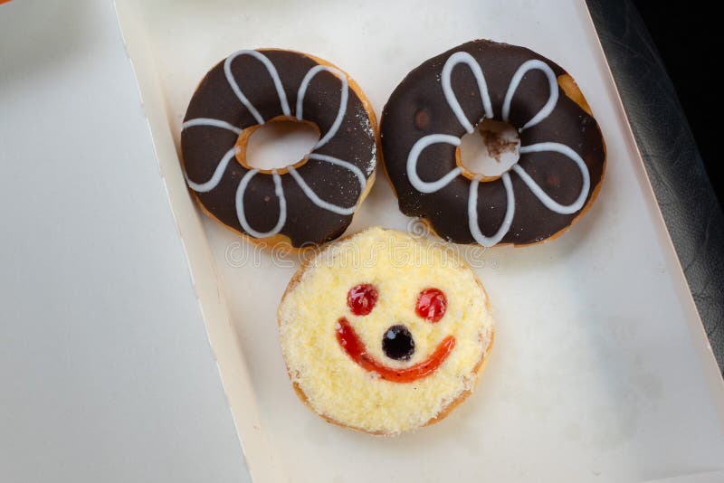 Smiley Face Donuts in a Cardboard Box Stock Image - Image of closeup ...