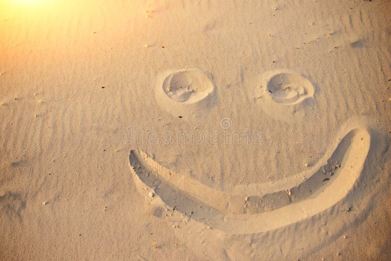 A Smiley Face Drawing on a Sand Stock Image - Image of happy, happiness ...