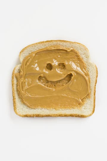 Smiley Face Drawn in Peanut Butter on Slice of Toa Stock Image - Image ...