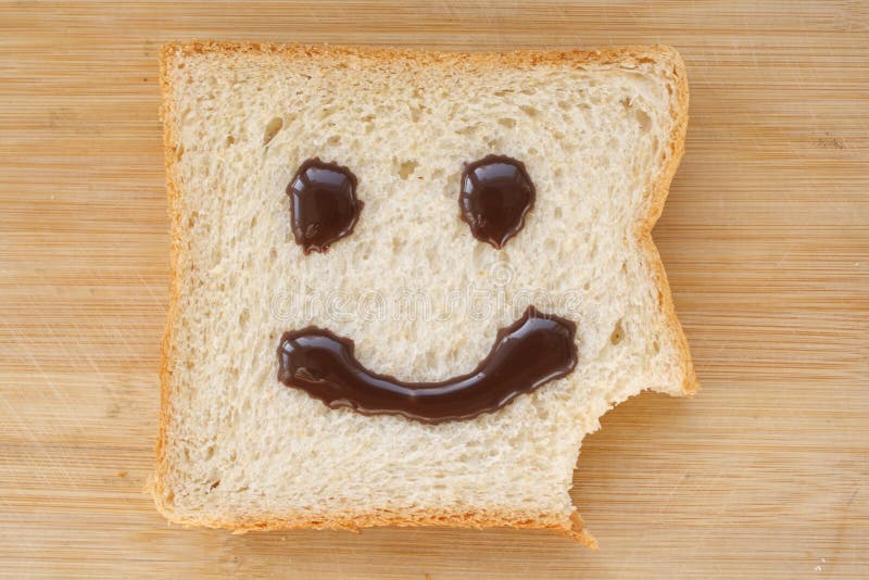 Smiley Face On A Piece Of Black Bread Stock Image - Image: 27956627