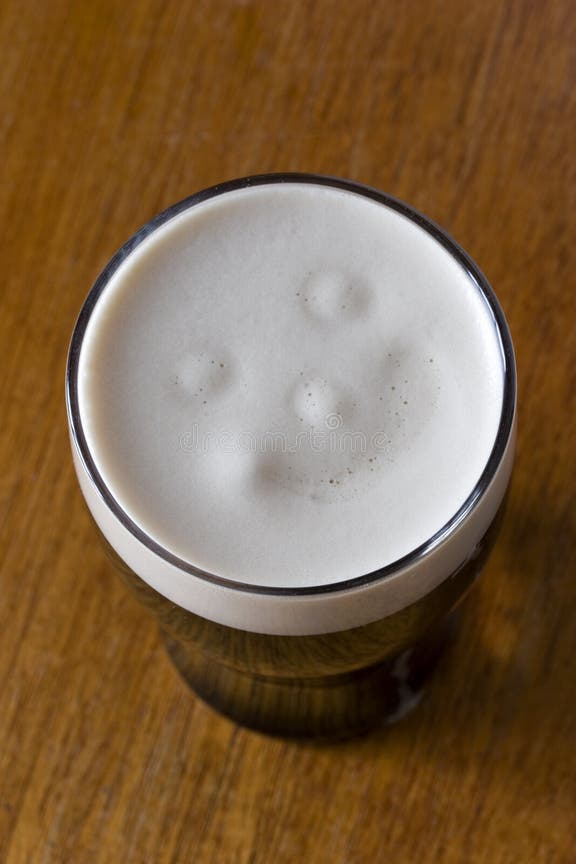 Smiley Face in a Pint of Stout Stock Image - Image of mouth, black: 295803