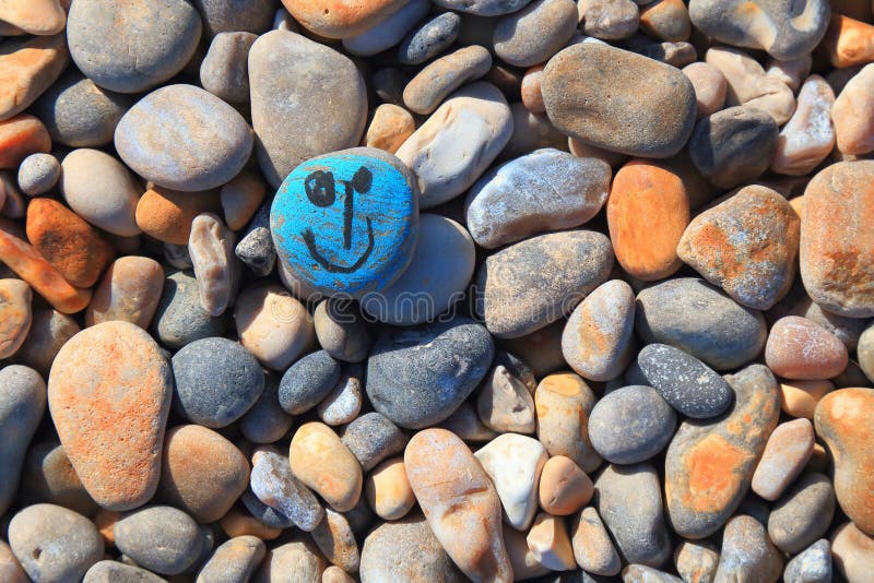 Smiley face on the stone stock photo. Image of shape - 122336408