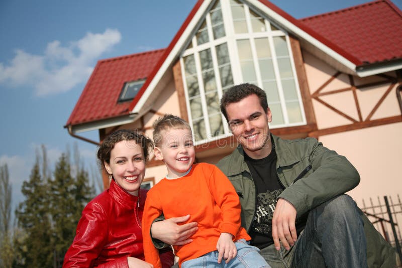 Happy Family in Front of the House Stock Photo - Image of outside ...