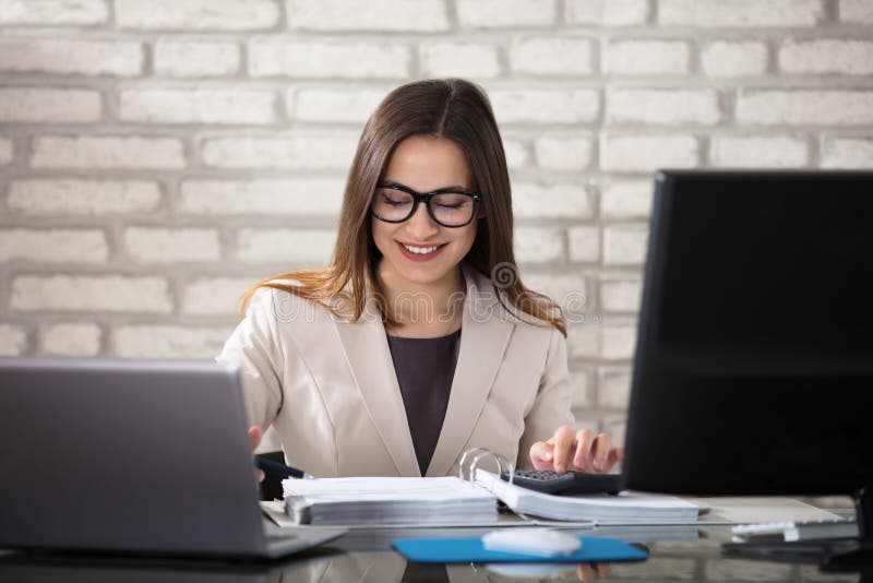 Smiling Accountant Using Calculator Stock Photo - Image of ...