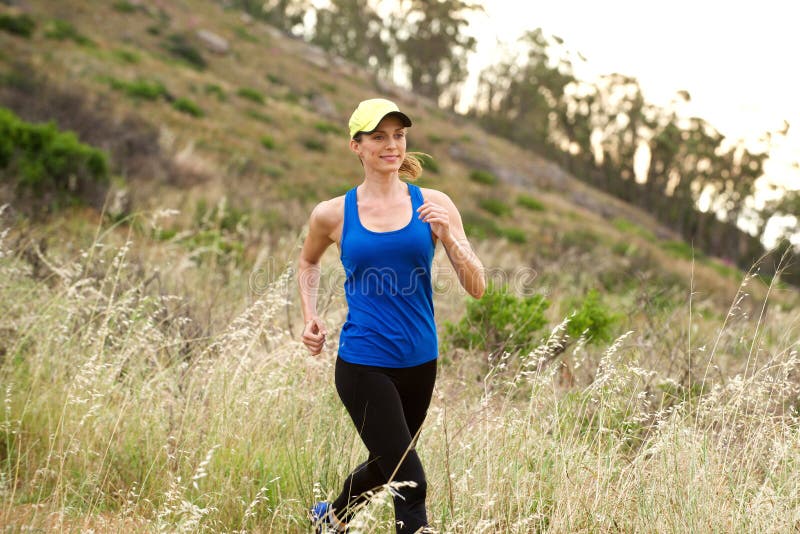 Smiling Active Woman Standing Outdoors Stock Photo - Image of freedom ...