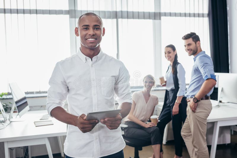 Smiling African American Businessman Stock Photo - Image of colleagues ... Smiling African American Businessman Stock Photo - Image of colleagues ...