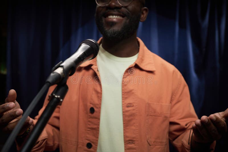 Smiling African American Singer Holding Microphone Stock Image - Image ...