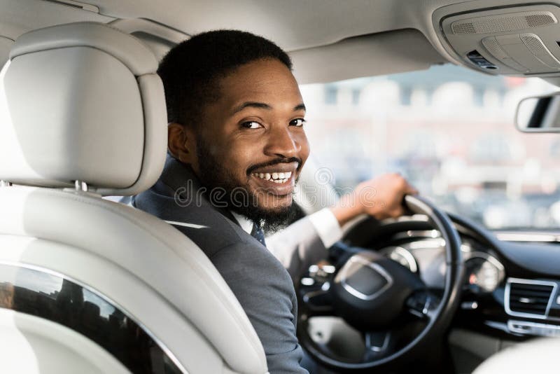 Smiling African Driver Looking at Camera Posing Sitting in Auto Stock ...