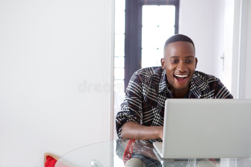 Smiling African Guy Working on Laptop at Home Stock Image - Image of ... Smiling African Guy Working on Laptop at Home Stock Image - Image of ...