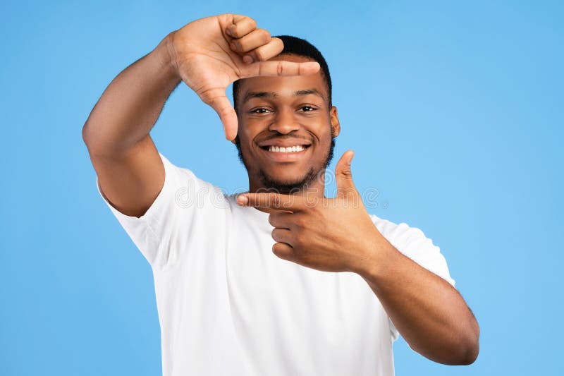 Smiling African Man Framing Face with Fingers on Blue Background Stock ...