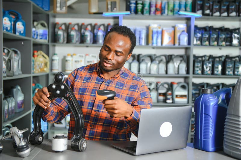 Smiling African Salesman Auto Parts Store Stock Photo - Image of shop ...