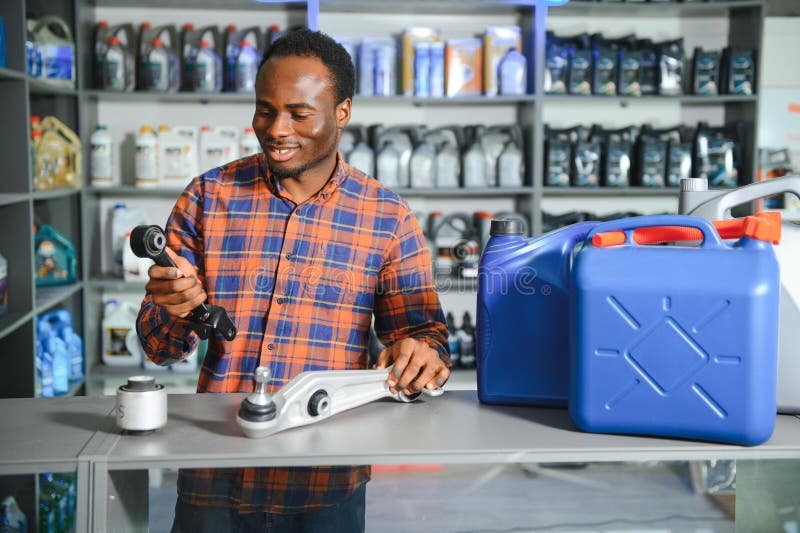 Smiling African Salesman Auto Parts Store Stock Photo - Image of ...